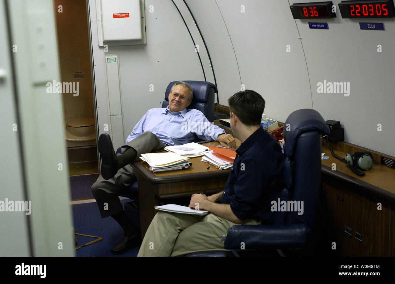 Secretary of Defense Donald H. Rumsfeld takes a well needed rest after ...