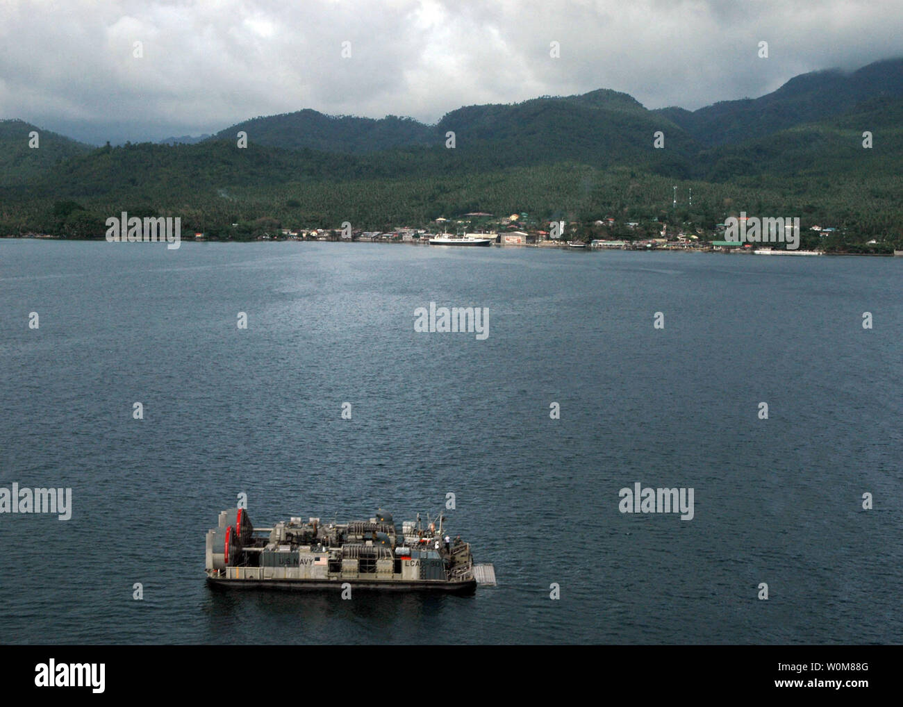 A U.S. Navy Landing Craft Air Cushioned (LCAC) maintains station in ...