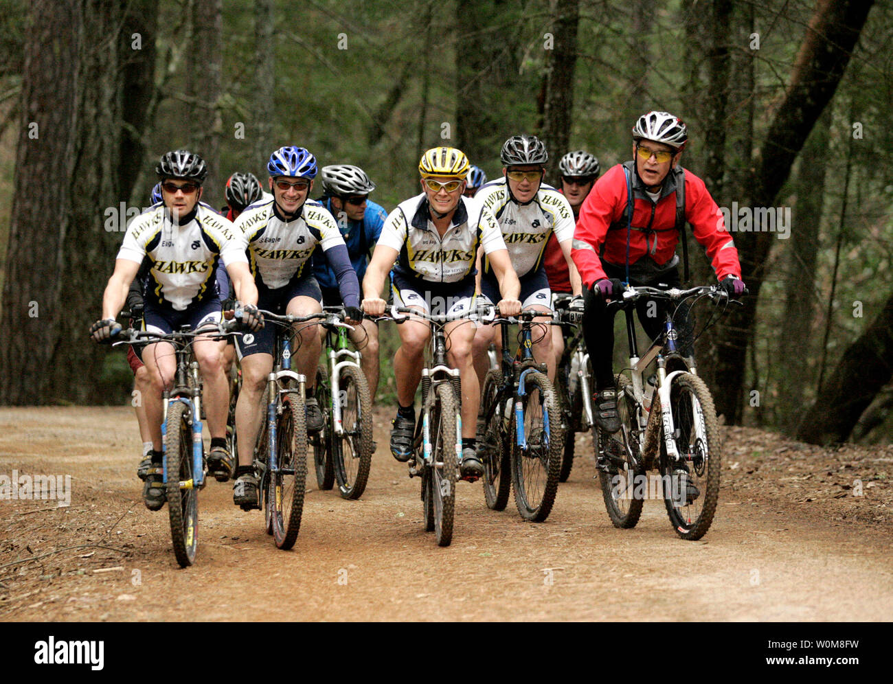 President George W. Bush rides with the Travis Air Force Base cycling ...