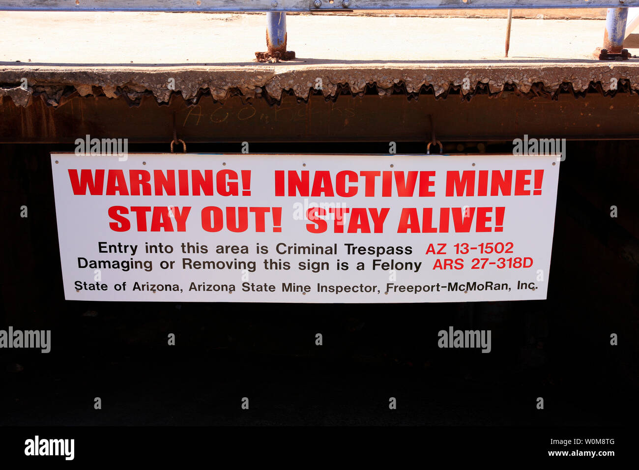 Warning! Inactive Mine! Stay Out! Stay Alive! sign above the entrance ...
