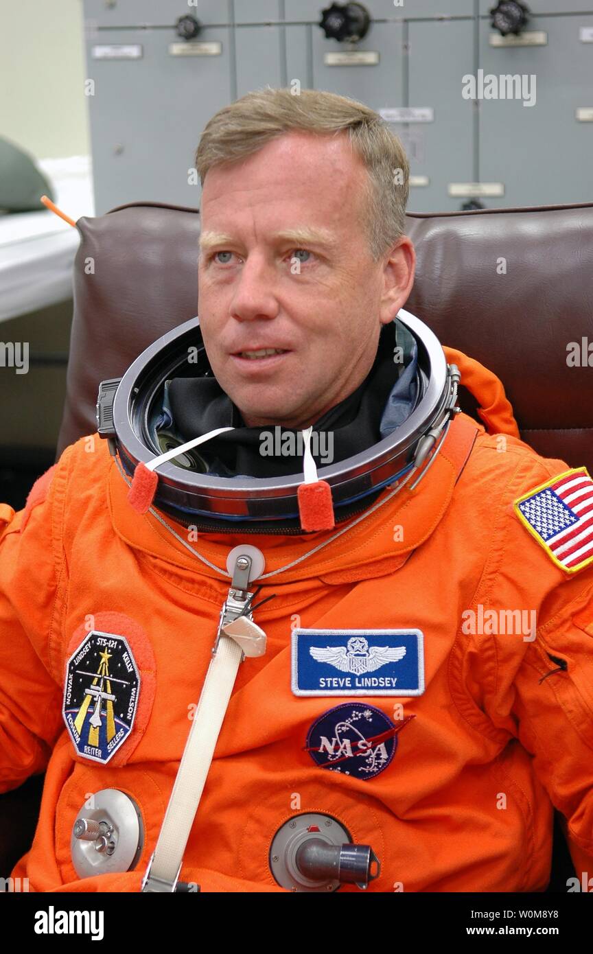 STS-121 Commander Steven Lindsey is donning his launch and entry suit ...
