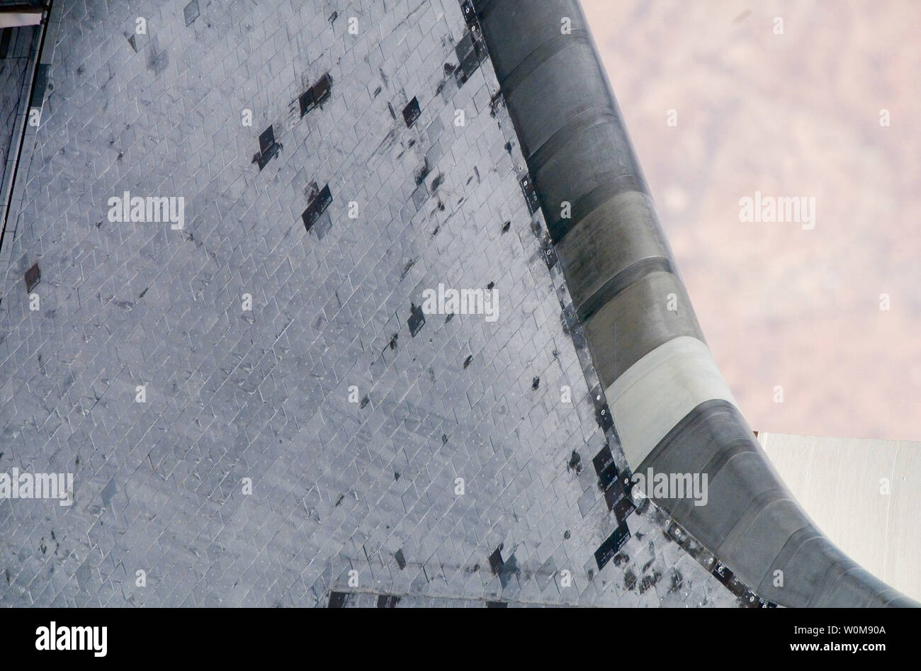 Part of the underside of Discovery's port side wing is featured in this ...