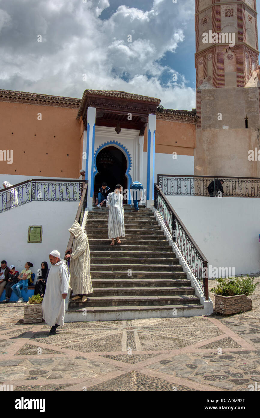 Chefchaouen, Morocco - May 03, 2019: Several Muslim men leaving the ...