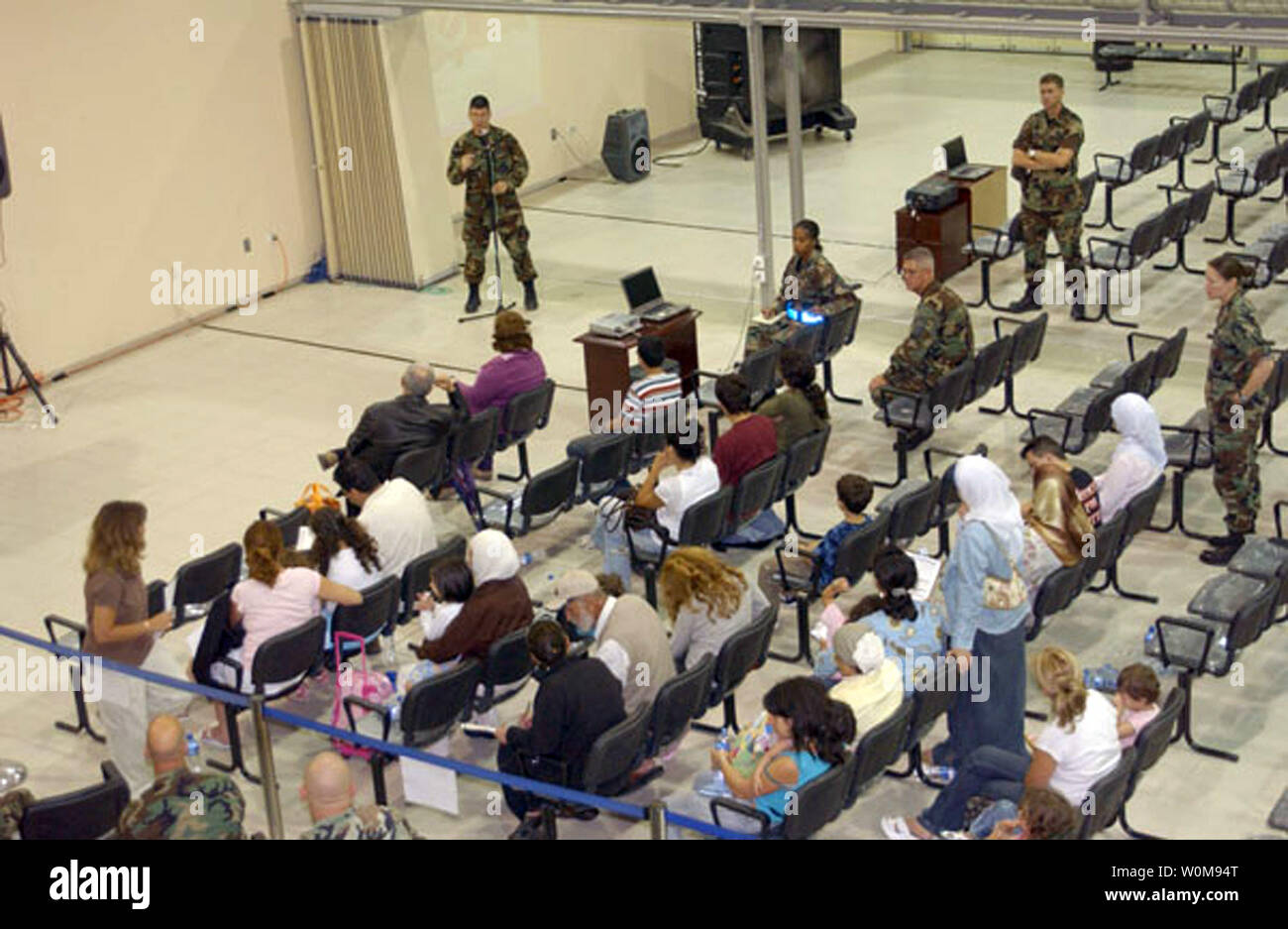 Members of the 39th Air Base Wing assist the Lebanon evacuees as they ...