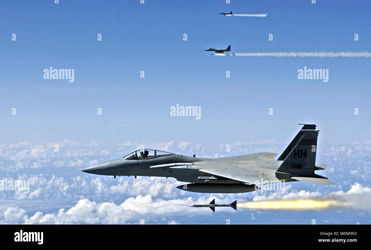 F-15 Eagles fire AIM-7 Sparrow missiles at a tactical air-launched ...