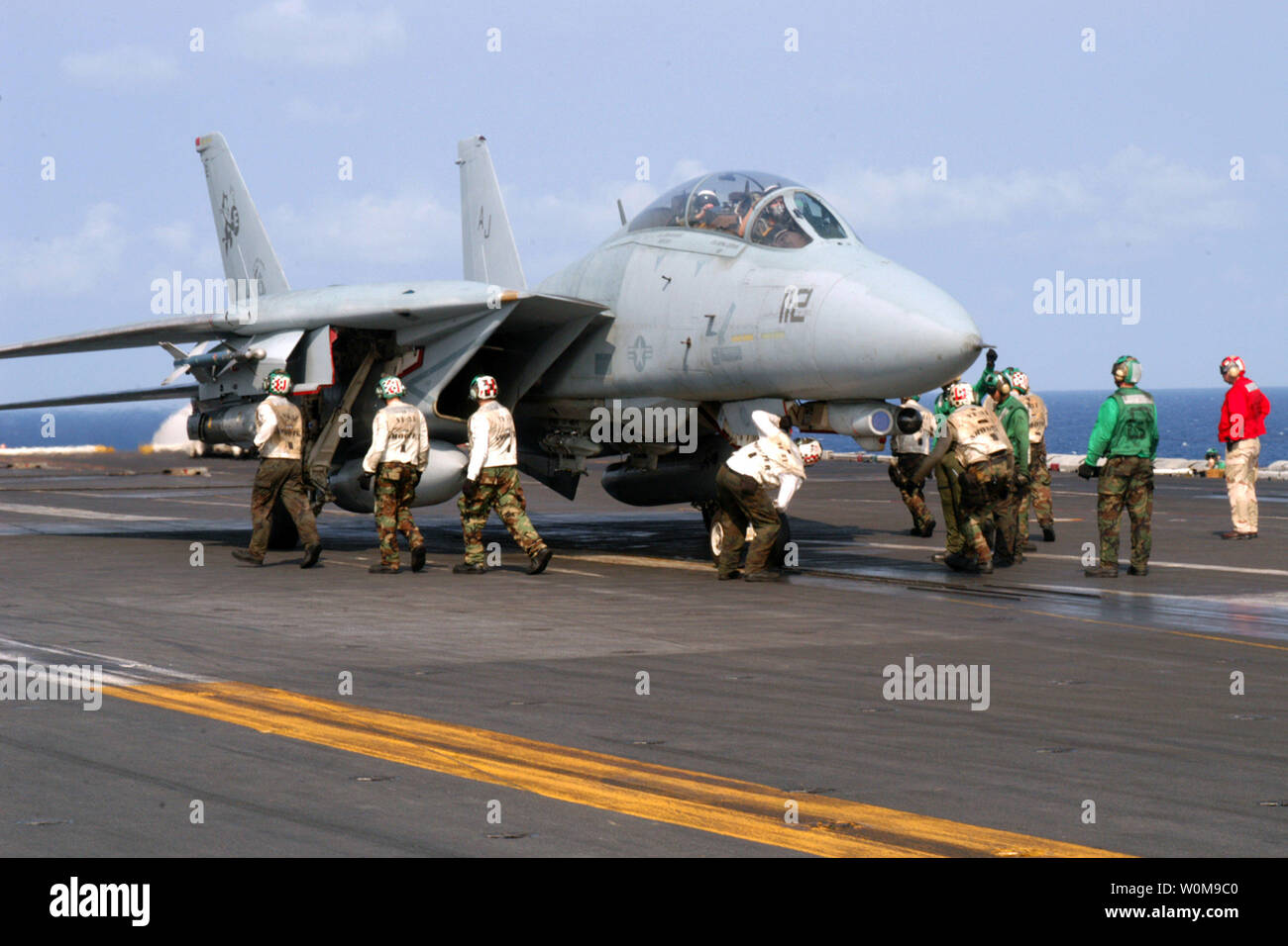 Aboard USS Theodore Roosevelt (CVN 71), an F-14D Tomcat makes final ...