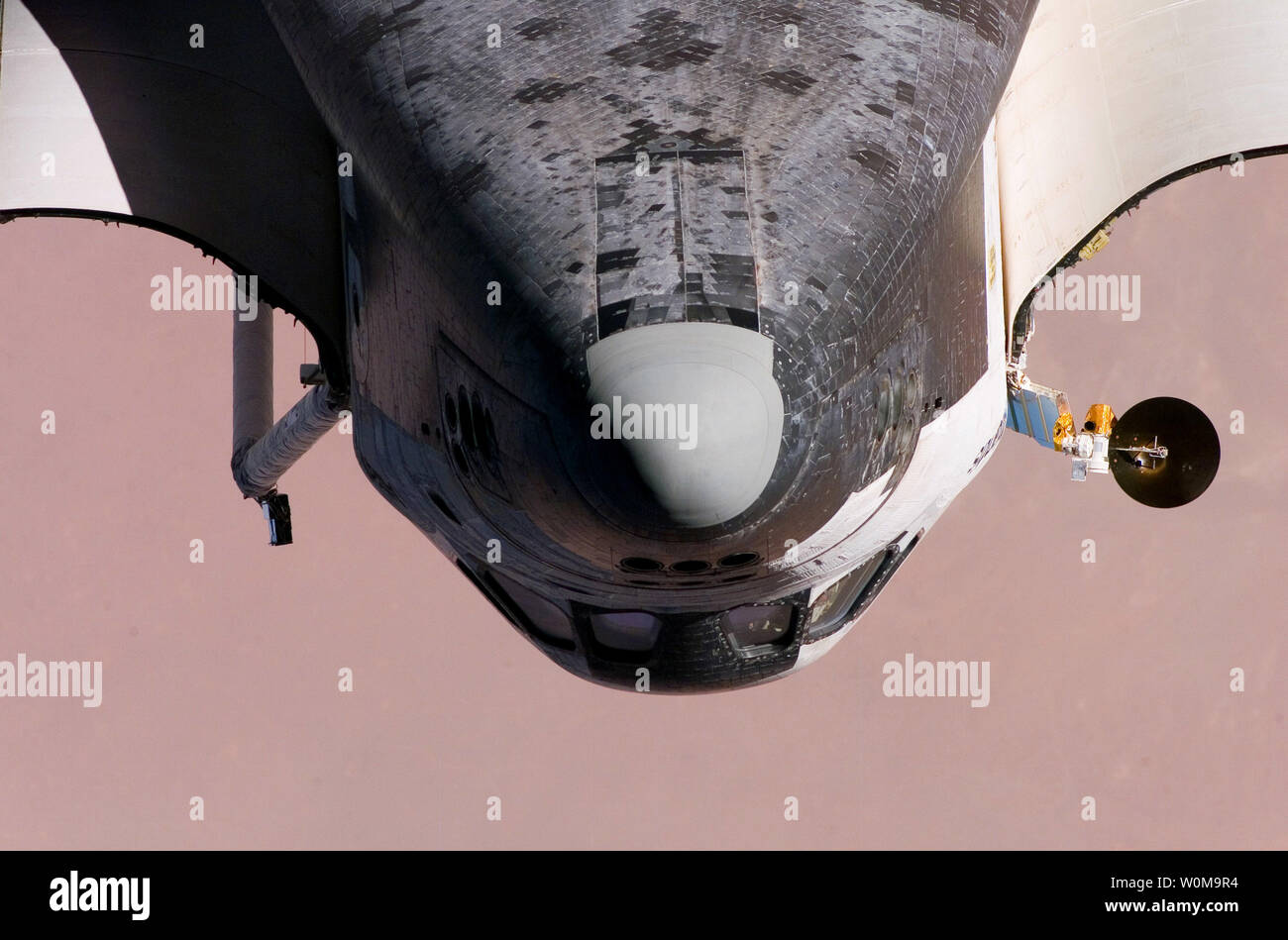 This view of the nose and part of the underside of the Space Shuttle ...