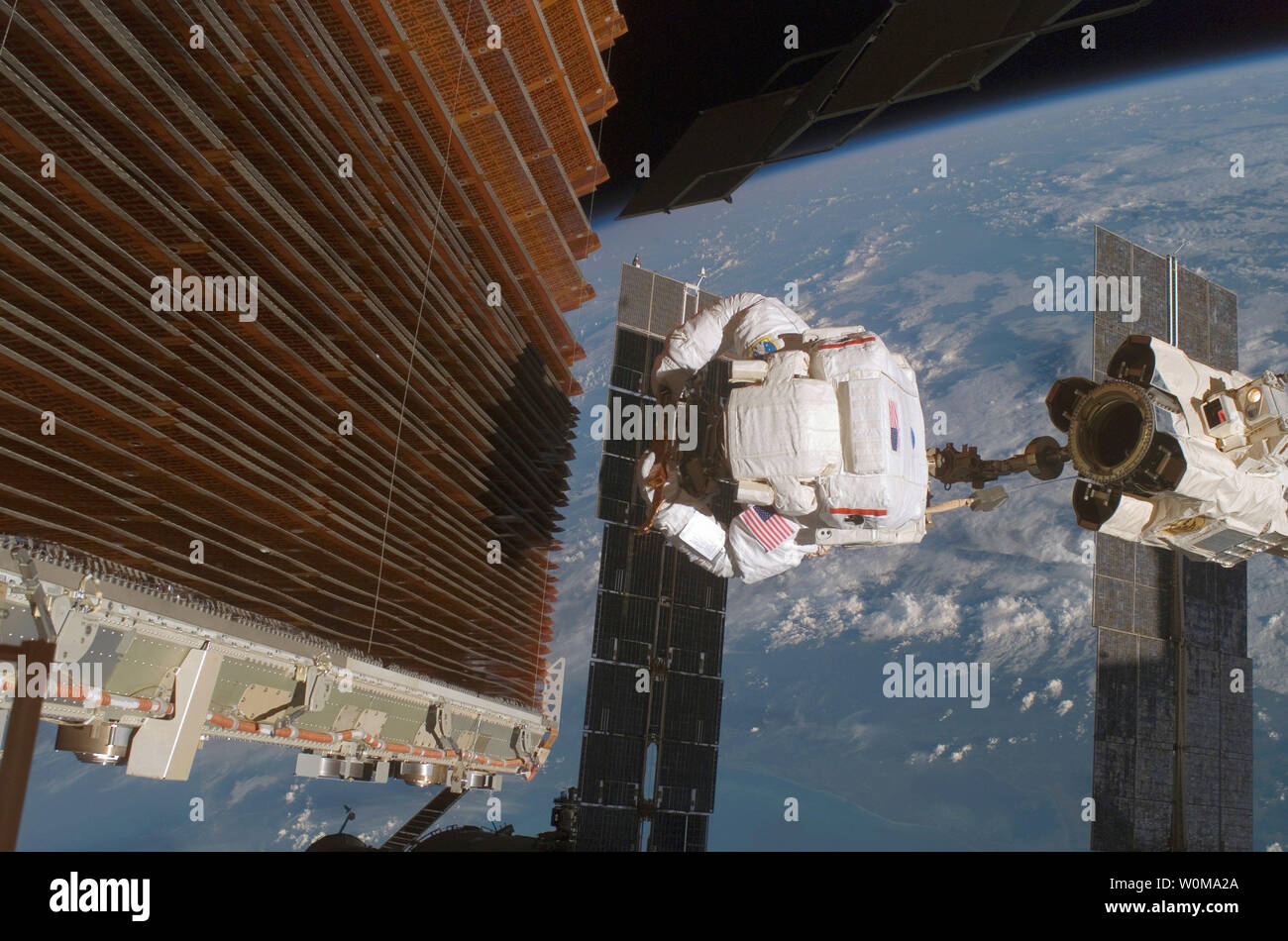 Astronaut works on port overhead hi-res stock photography and images ...