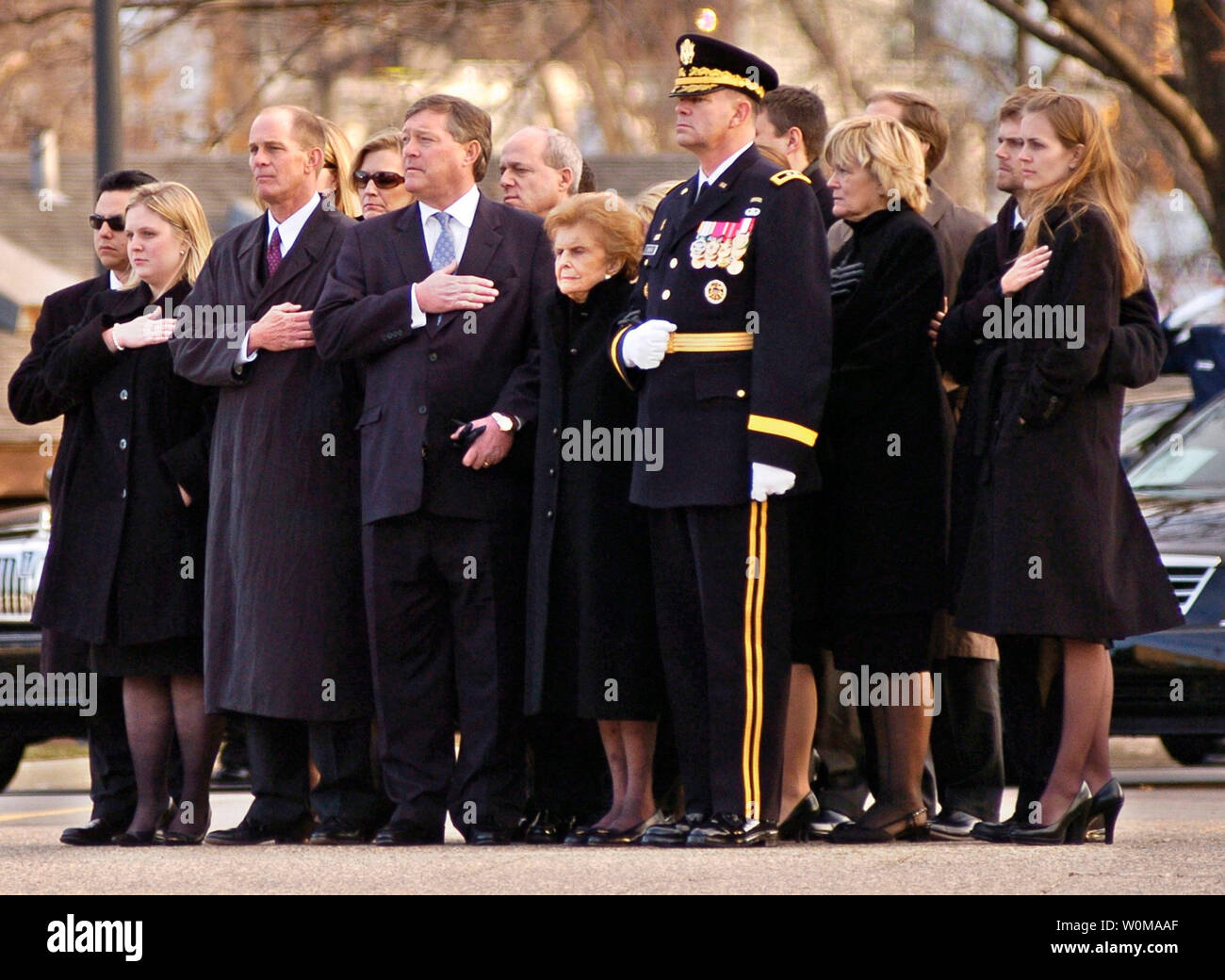 The Ford family stands together as the casket of Gerald Ford is moved ...