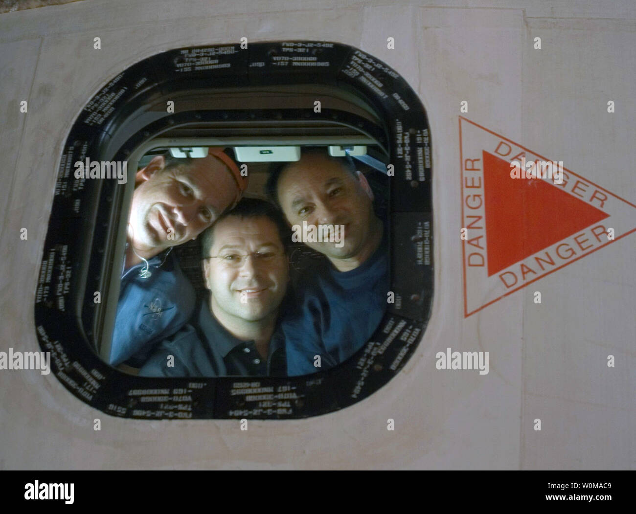 On Space Shuttle Discovery, astronauts William A. (Bill) Oefelein (L ...