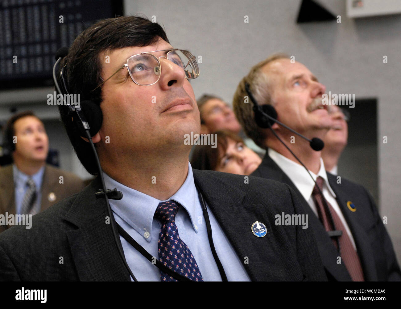 NASA Associate Administrator Chris Scolese (L) and other managers watch ...