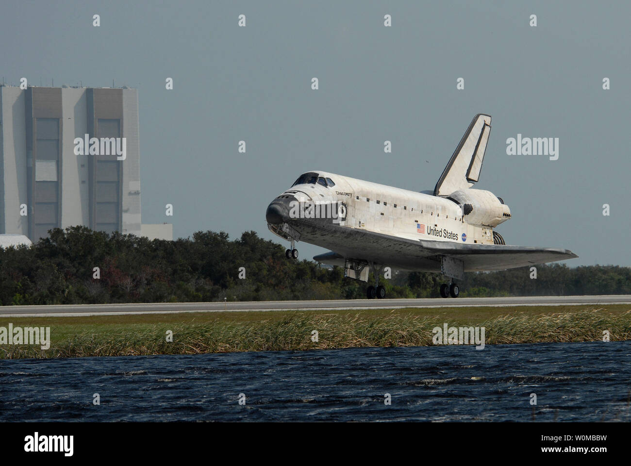 NASA's Space Shuttle Discovery lands safely on Runway 33 of the Shuttle ...
