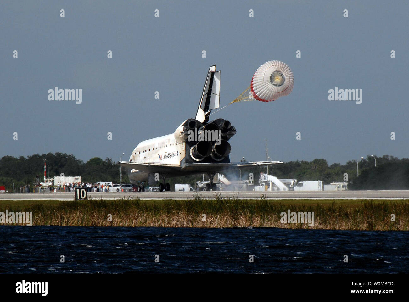 NASA's Space Shuttle Discovery lands safely on Runway 33 of the Shuttle ...