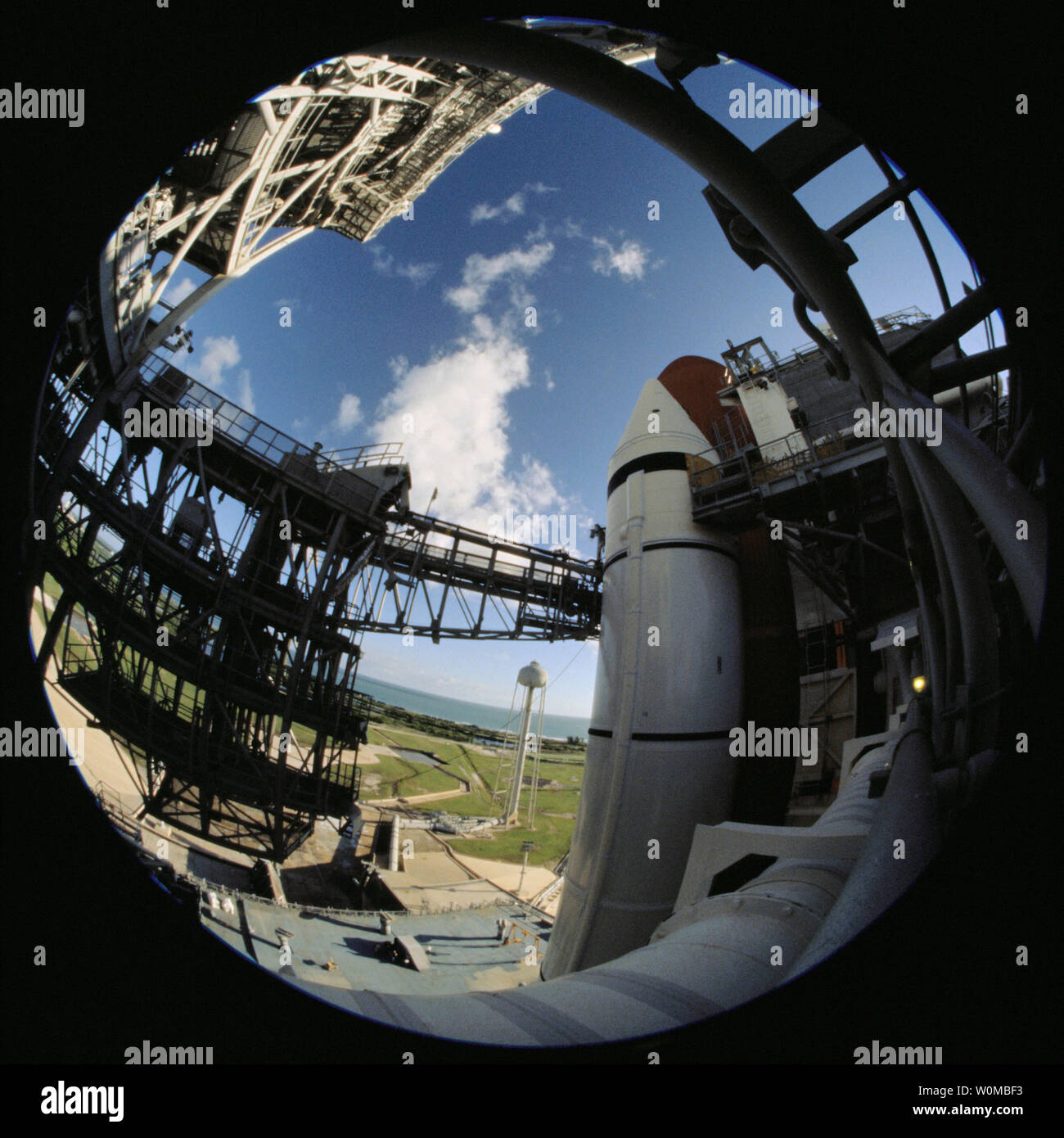This view of Space Shuttle Discovery at the launch pad was taken as the ...