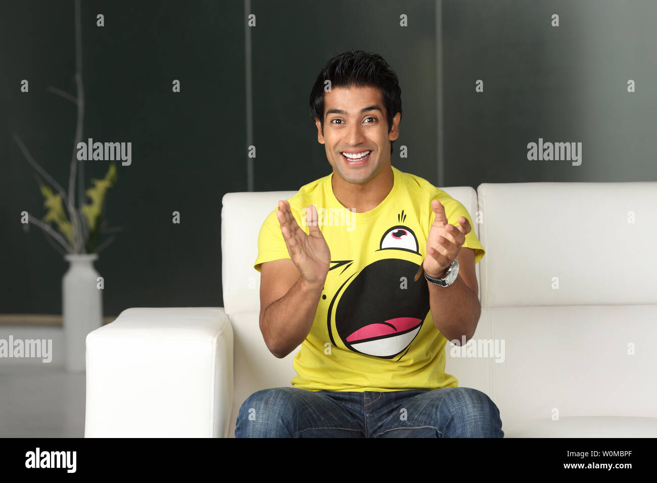 Indian young man clapping hands Stock Photo - Alamy