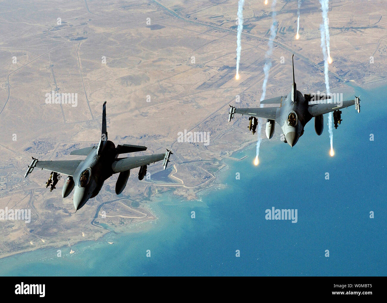 A single US Air Force (USAF) F-16C Fighting Falcon aircraft fires ...