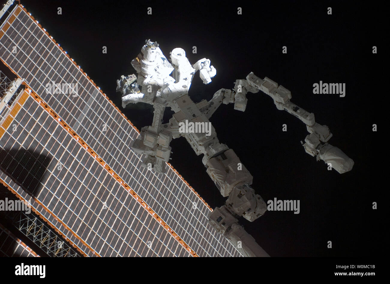 In the grasp of the station's robotic Canadarm2, Dextre, also known as ...