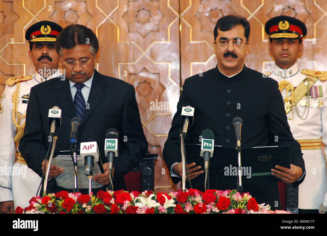 Pakistani President Pervez Musharraf (L) swears in Yousaf Raza Gilani ...