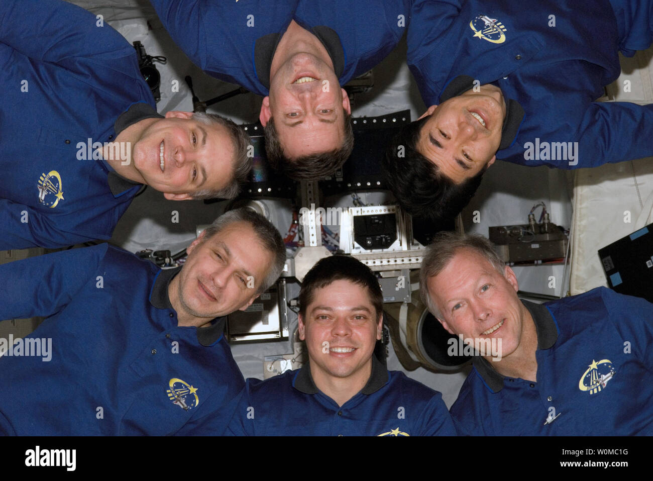 The STS-123 crew are pictured on the International Space Station on ...