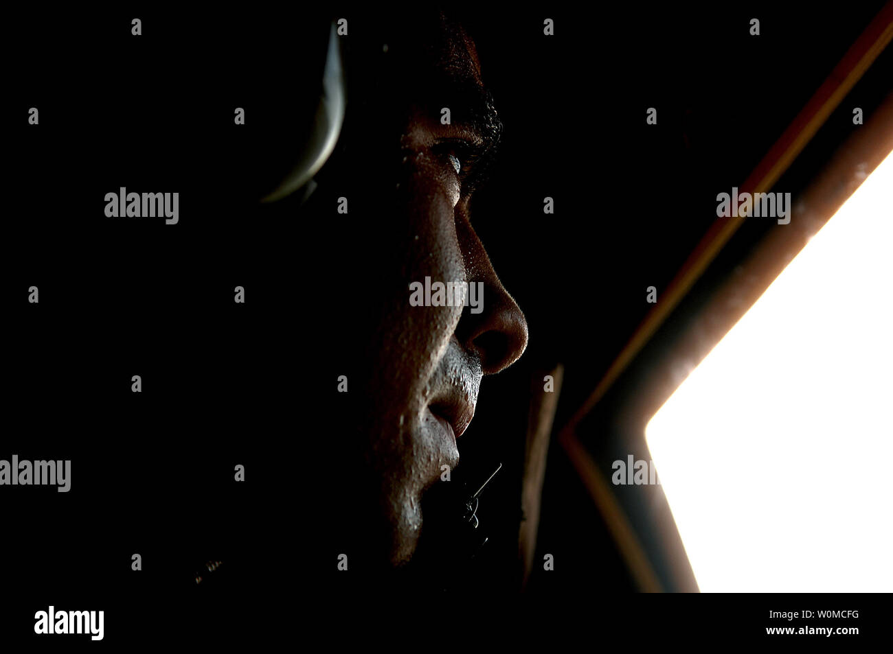 U.S. Air Force Airman 1st Class Nicholas Greer scans the skies through ...