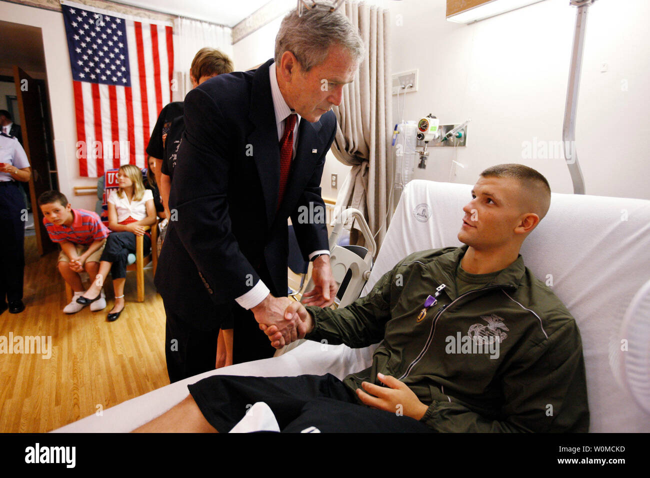 U.S. President George W. Bush shakes hands with U.S. Marine Corps Pfc ...