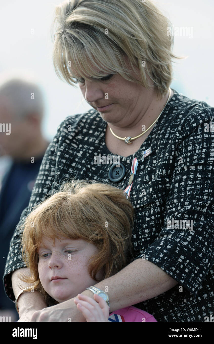 Stephanie Dunn Simone and her daughter, Alice Dunn, bow their heads ...