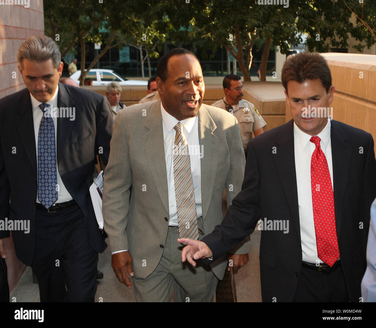 O.J. Simpson arrives at court for the opening day of his trial in Las ...