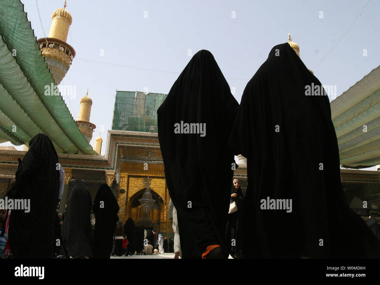 Iraqi women visit the shrine of Imam Mussa Kadhim in Baghdad's Shiite ...