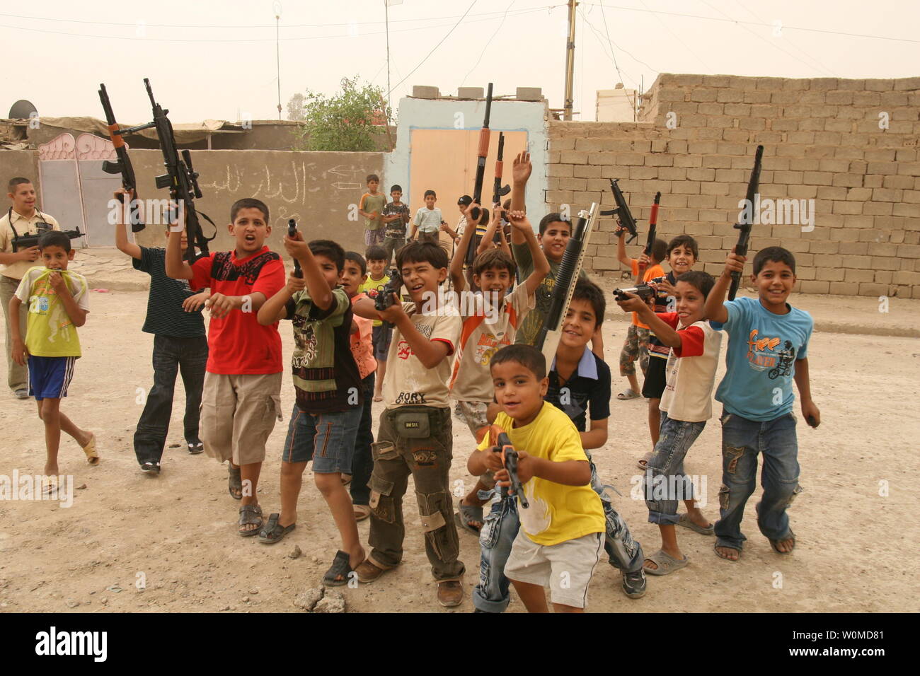 Iraqi boys play with toy guns to celebrate Eid al-Fitr in Baghdad, Iraq ...