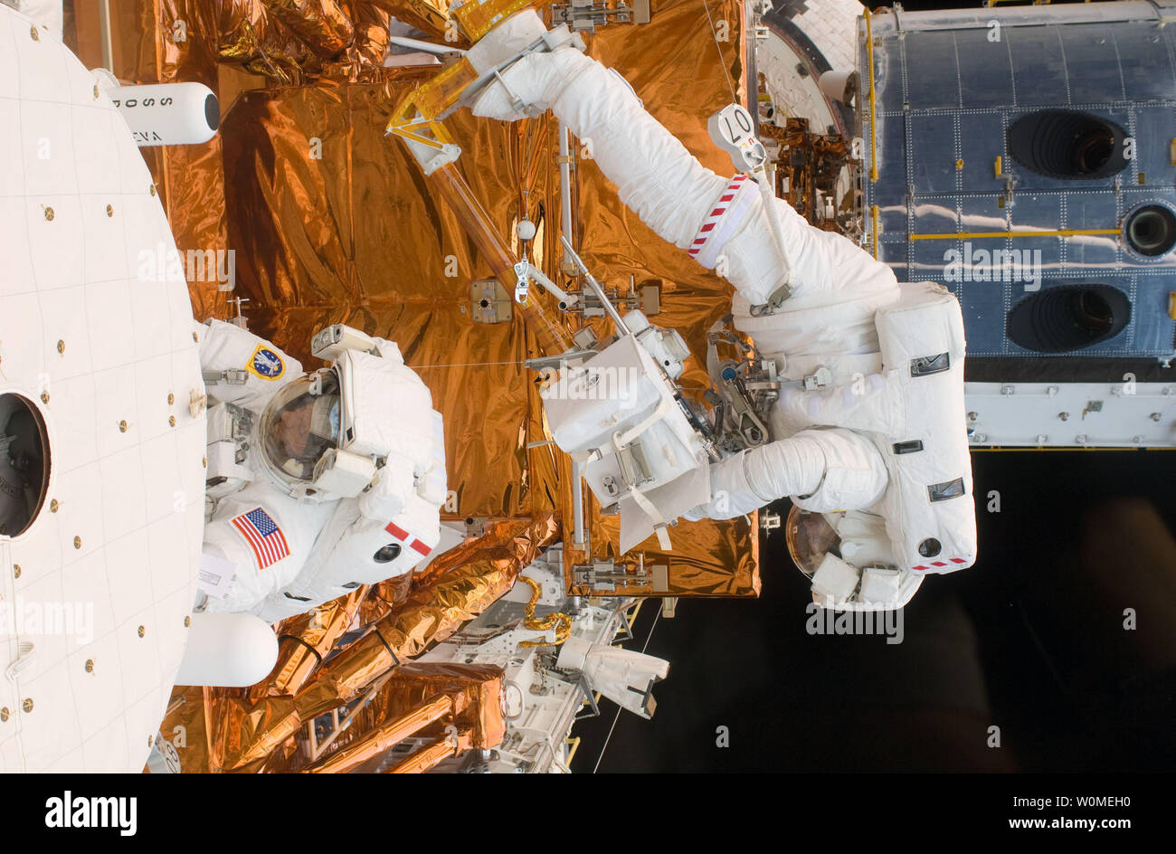 This NASA photo shows STS-125 Astronauts Michael Good (R) and Mike ...