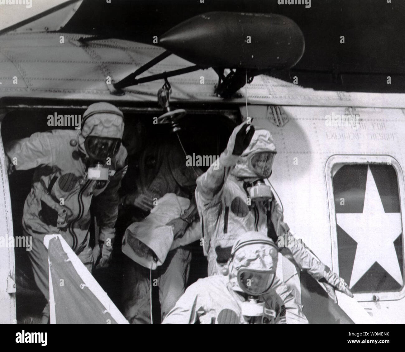 Donned in biological isolation garments, the Apollo 11 crew members, (L ...