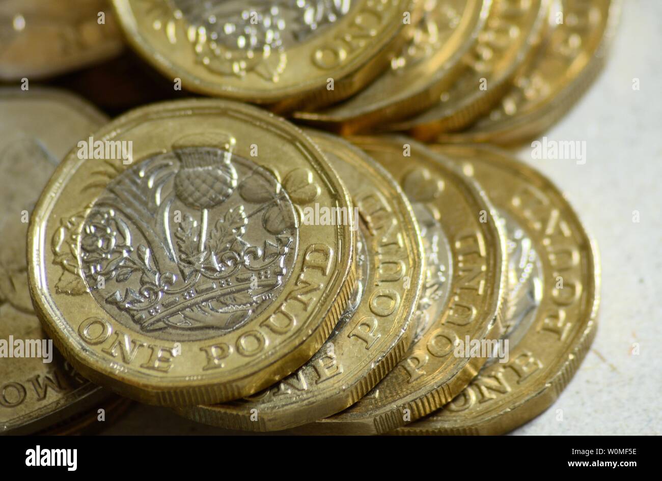 Piles of new pound coins Stock Photo - Alamy