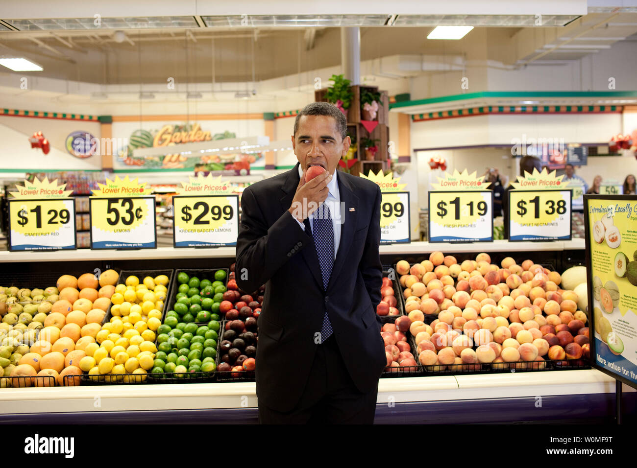U.S. President Barack Obama eats a nectarine following a town hall ...