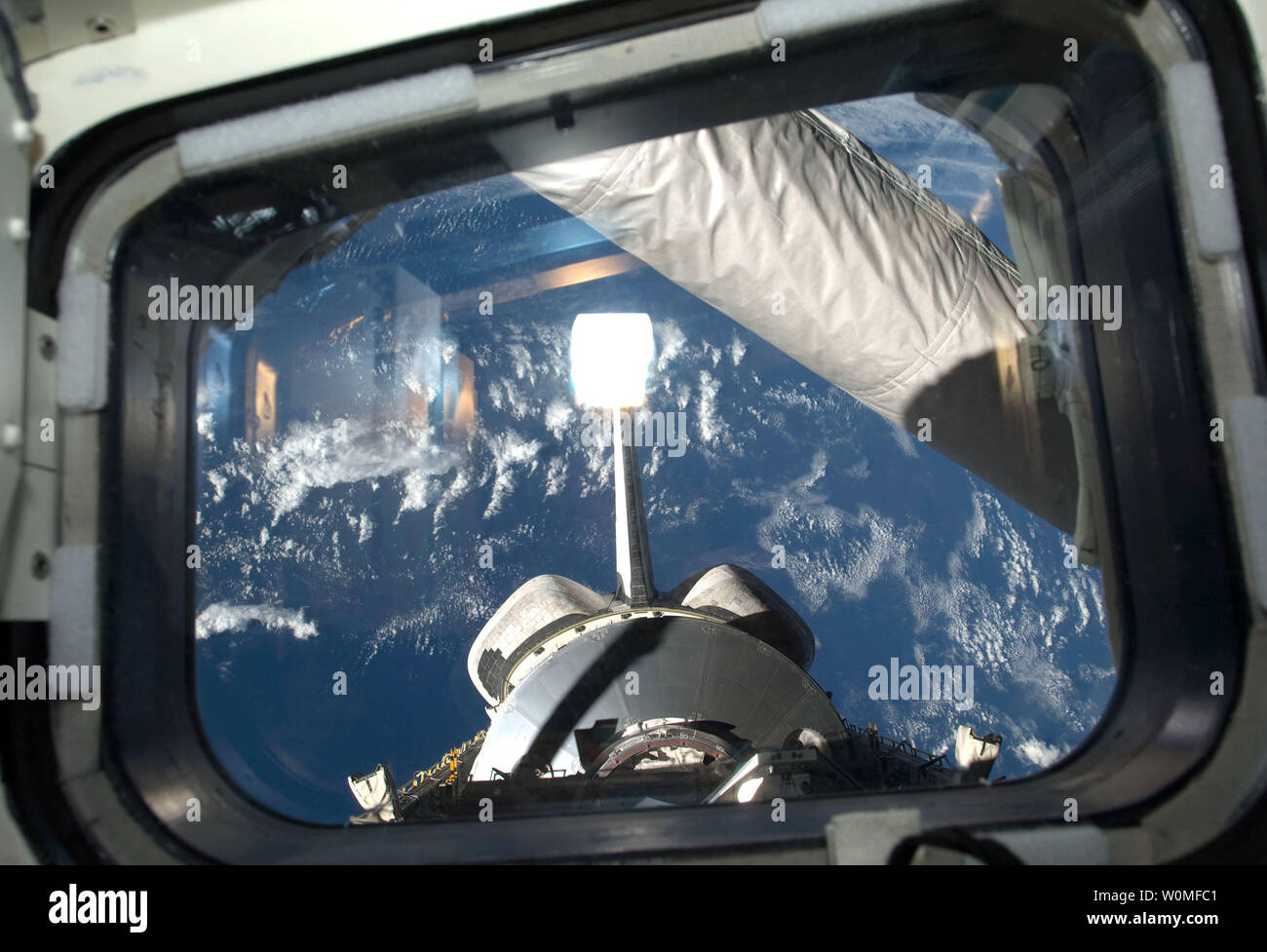 This NASA image taken by astronauts aboard Space Shuttle Discovery on ...