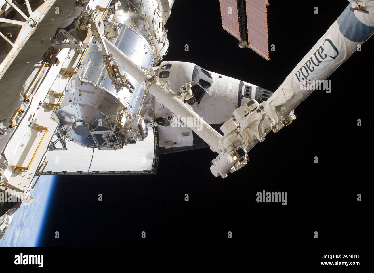 This NASA photo taken by STS-129 crew member shows Space Shuttle Atlantis as it is docked to the ...