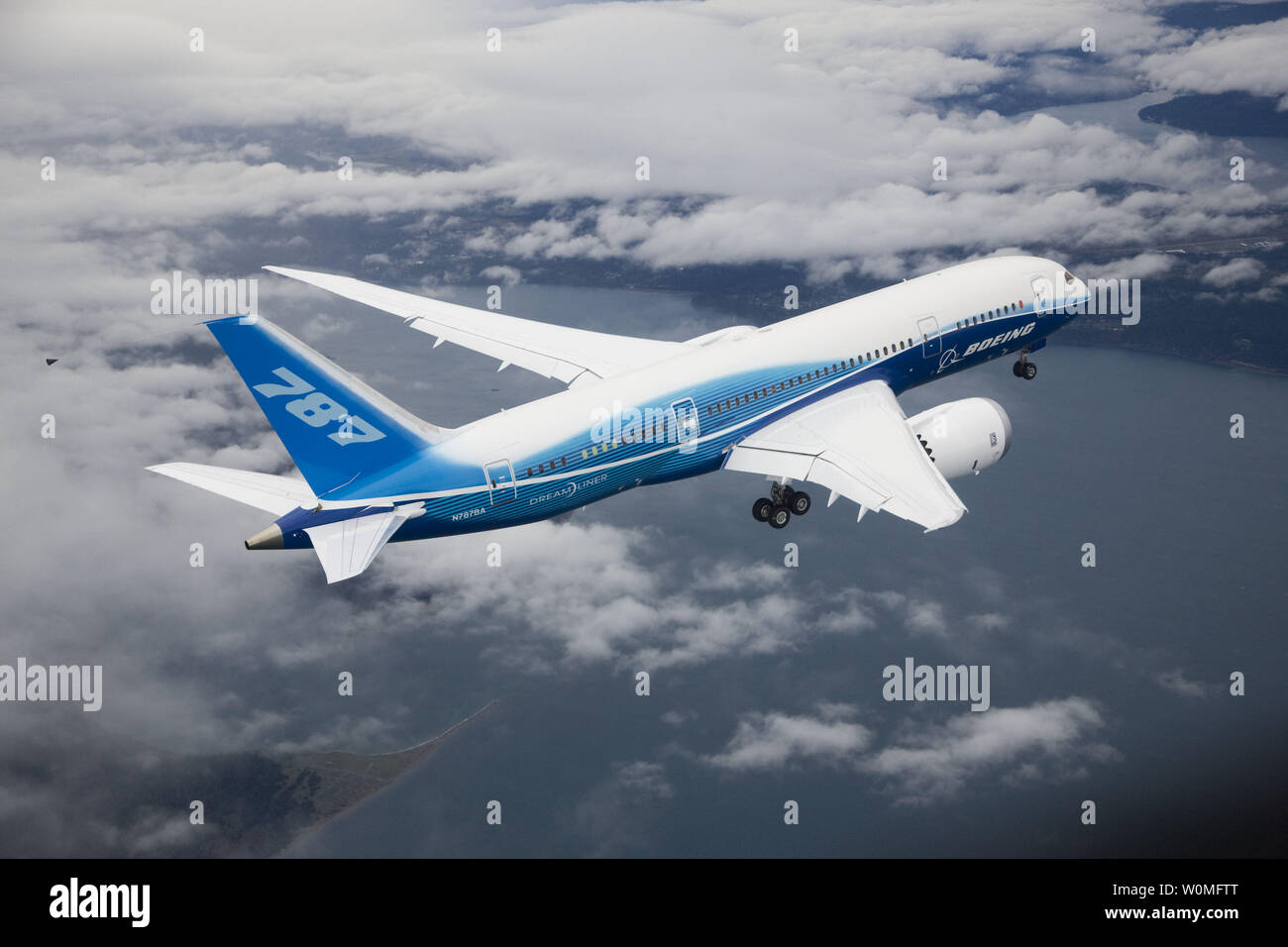 The Boeing 787 Dreamliner is seen in the air on its maiden flight on ...