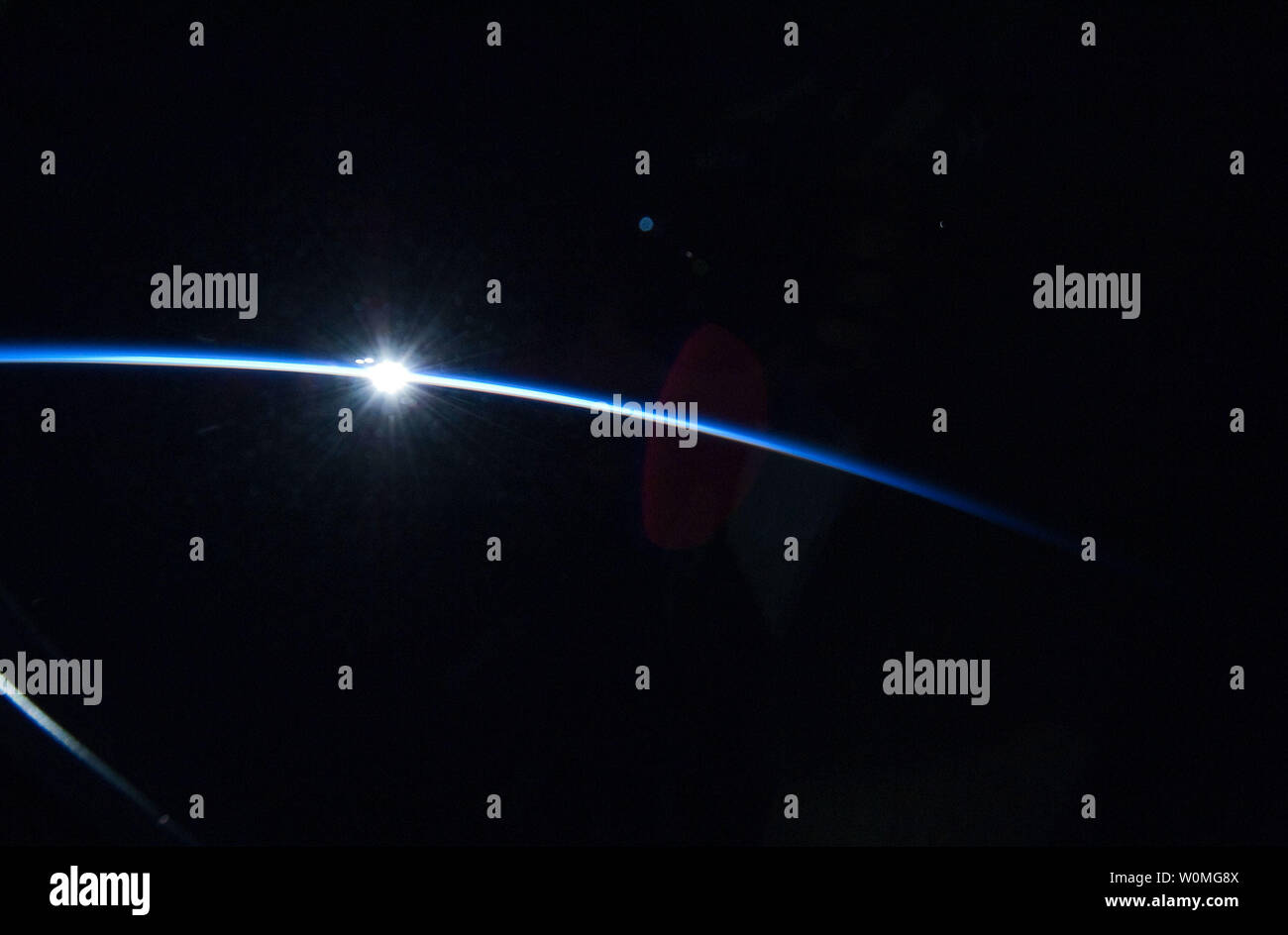This NASA image taken on February 9, 2010 shows the thin line of Earth ...