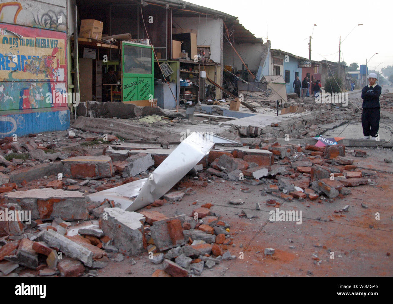Damaged buildings and debris is seen after an 8.8 magnitude earthquake ...
