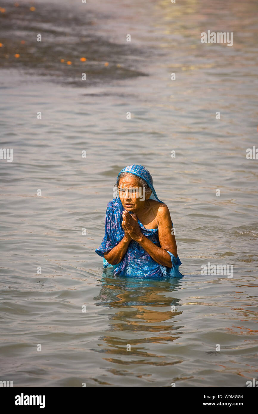 Hindu devotee takes holy bath hi-res stock photography and images - Alamy