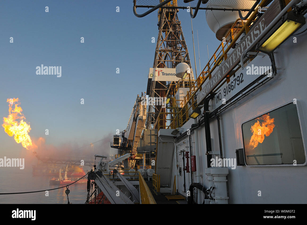Gas from the damaged Deepwater Horizon wellhead is burned by the ...