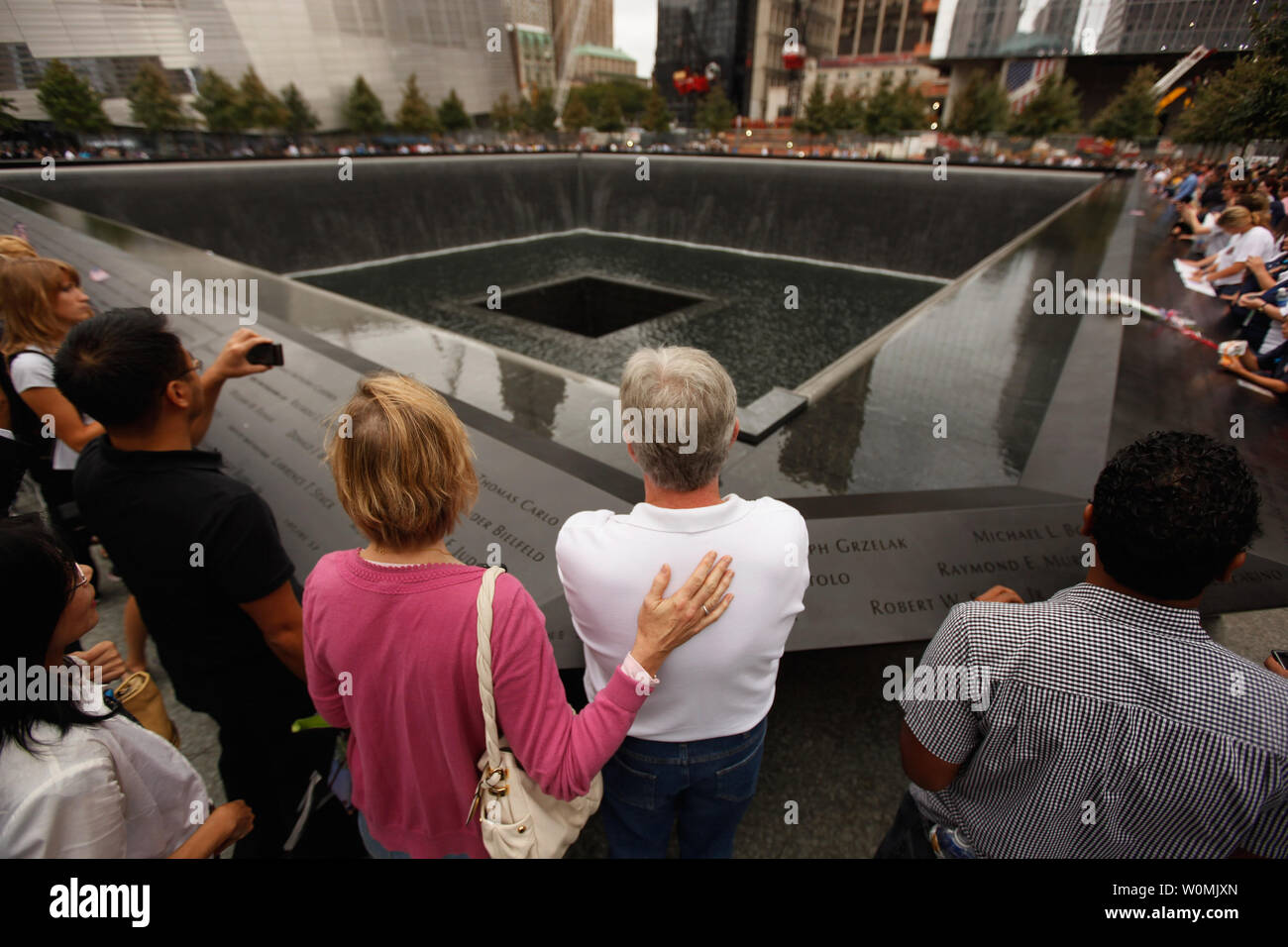 Family members of the victims of the September 11 terror attacks stand ...