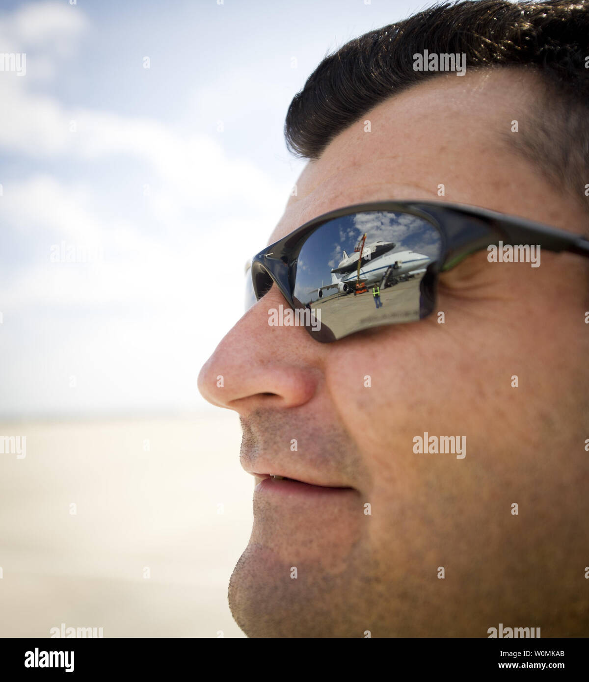NASA Orbiter Transition & Retirement team member Tom Goebel monitors ...