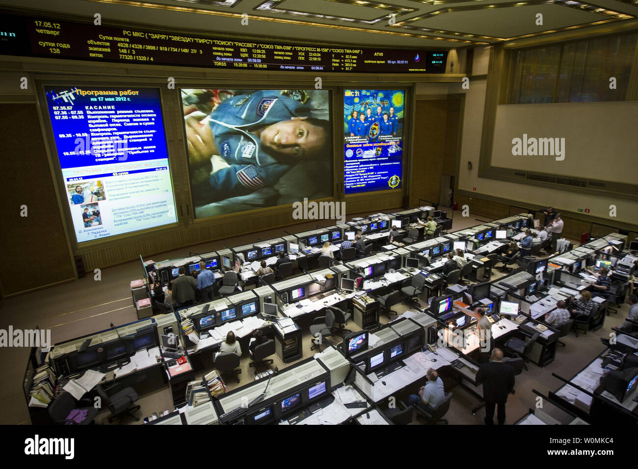 Expedition 31 Flight Engineer Joe Acaba is seen on the TV screen at the ...