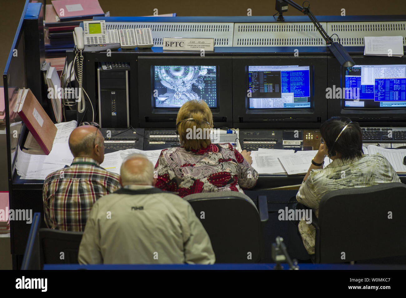 Russian flight controllers at the Russian Mission Control Center in ...
