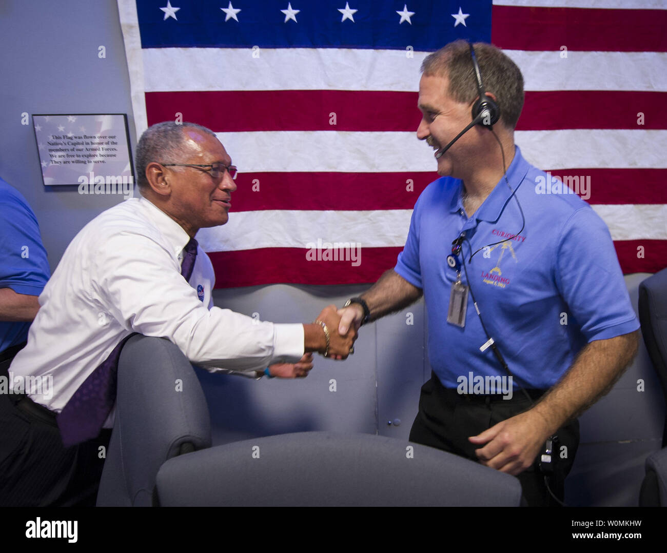 NASA Administrator Charles Bolden congratulates NASA Associate ...