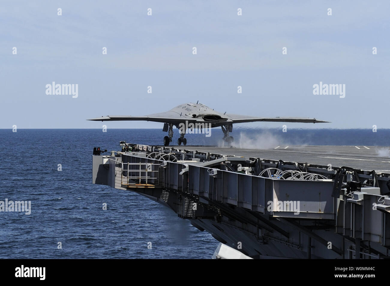 An X-47B Unmanned Combat Air System (UCAS) demonstrator launches ...