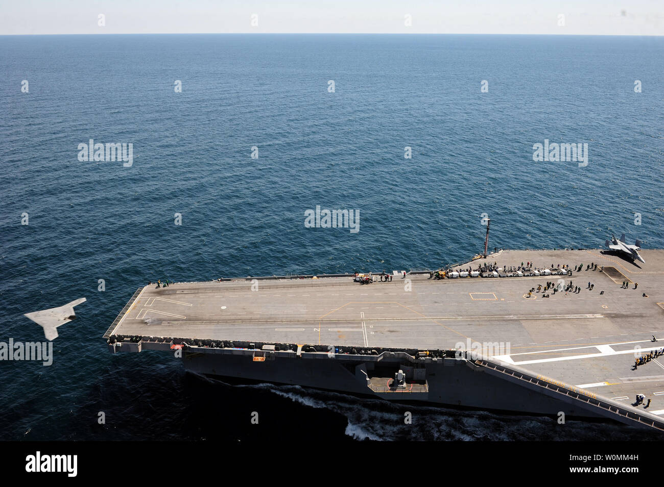 An X-47B Unmanned Combat Air System (UCAS) demonstrator launches ...