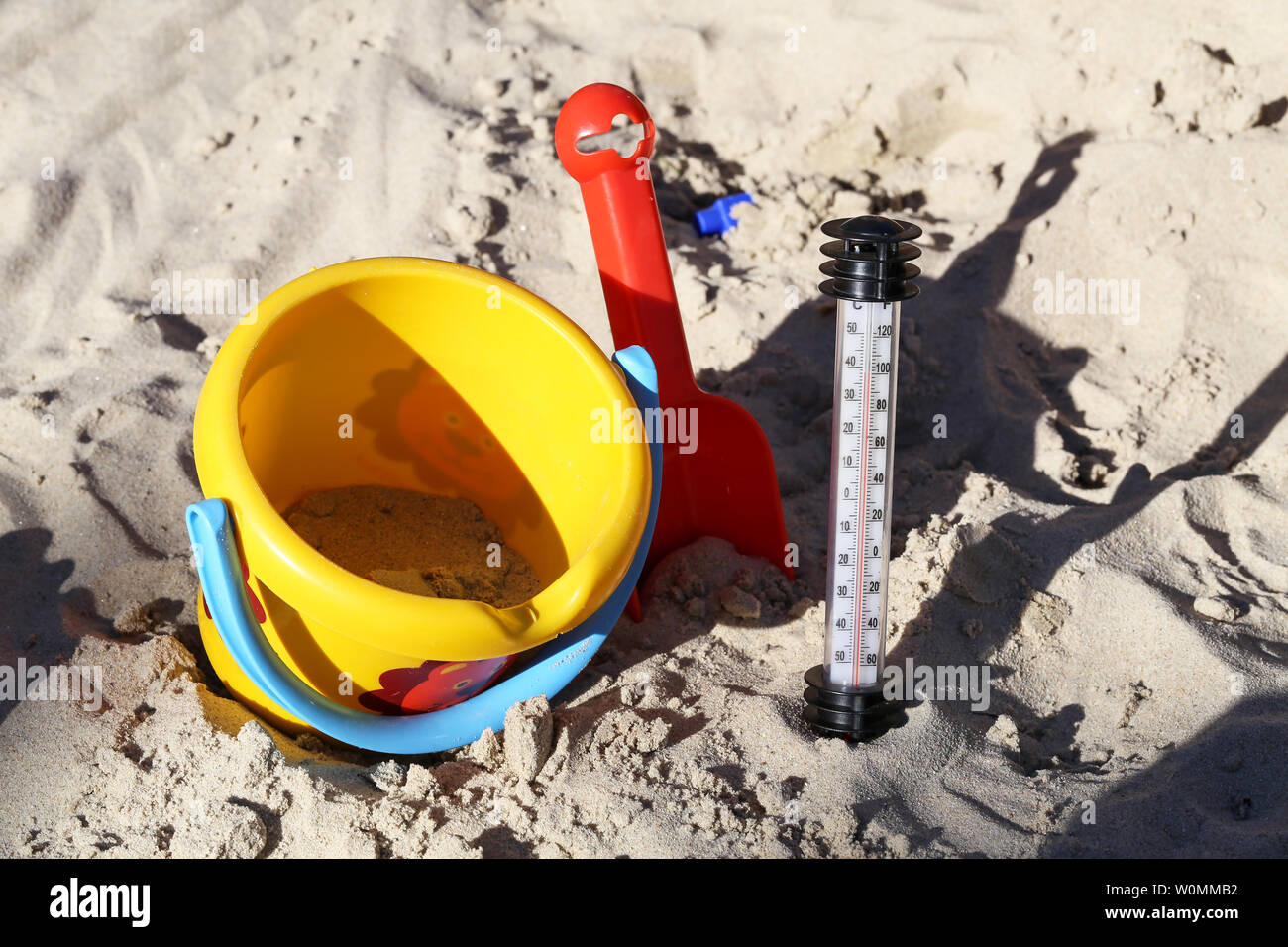 Hot Summer. Thermometer in the sand on the beach Stock Photo - Alamy