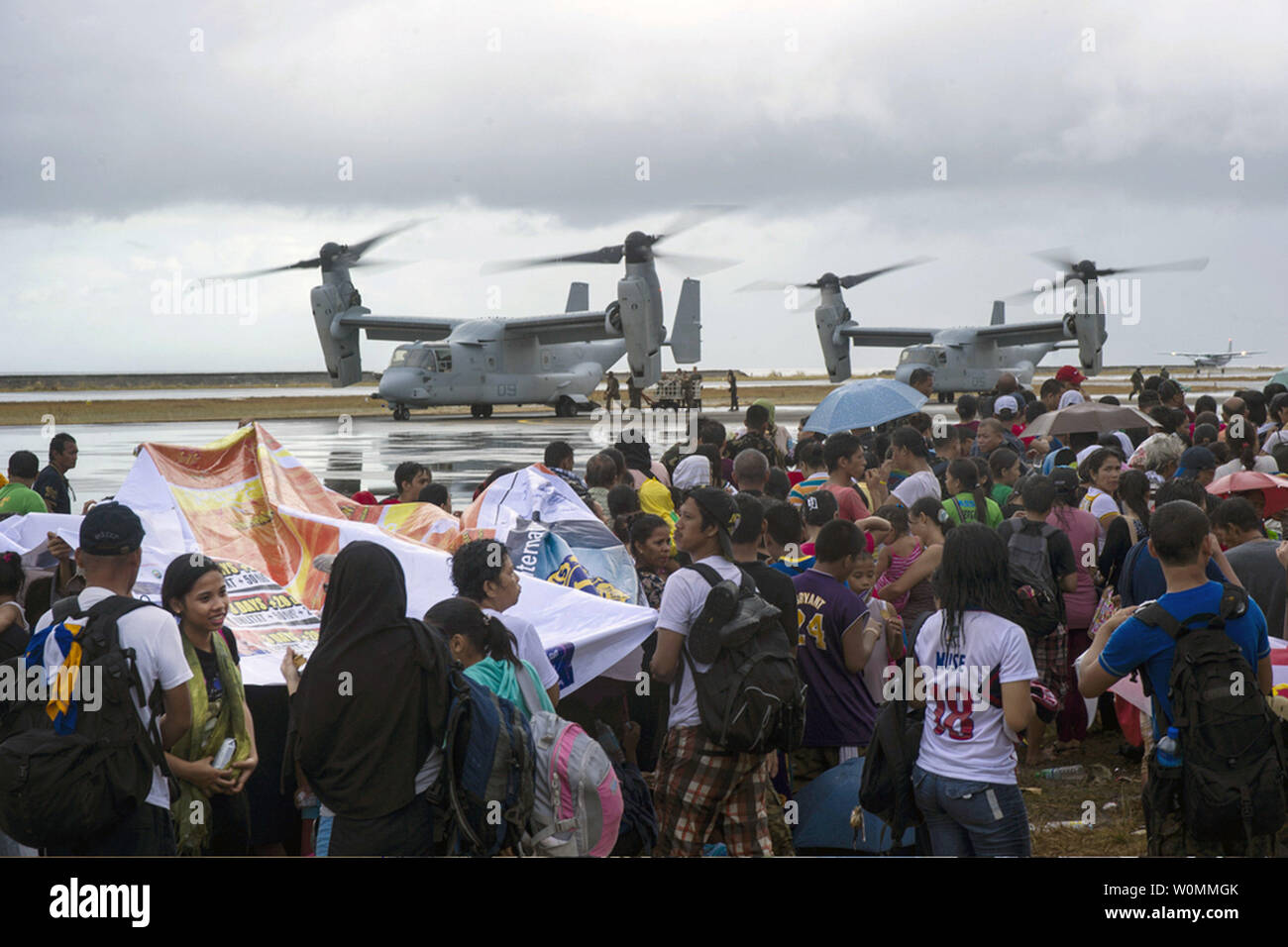 Supplies are loaded onto U.S. Marine Corps MV-22 Osprey aircraft as the ...