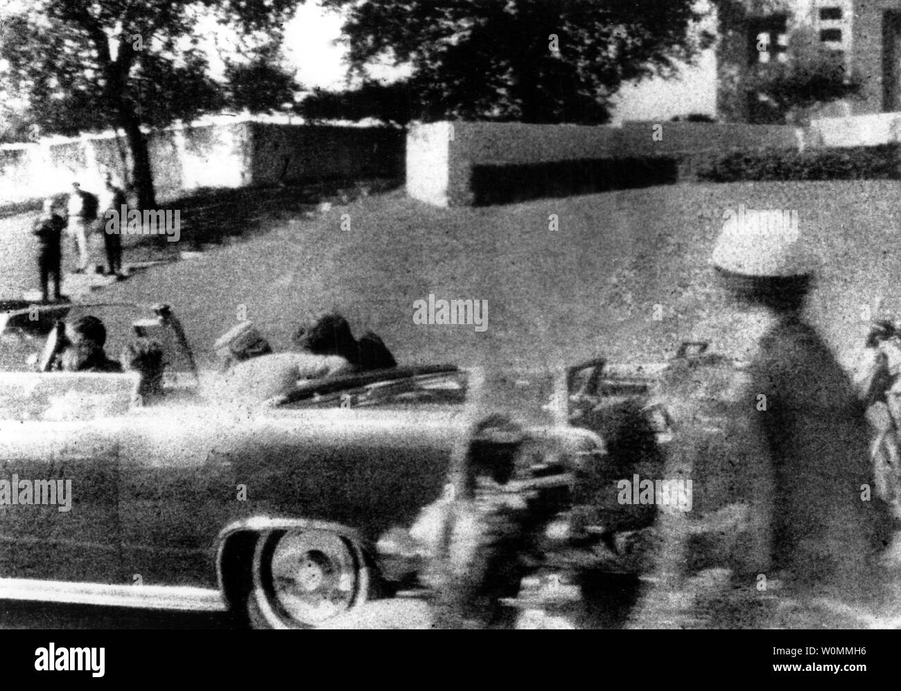 President John F. Kennedy slumps into the arms of his wife, Jackie ...